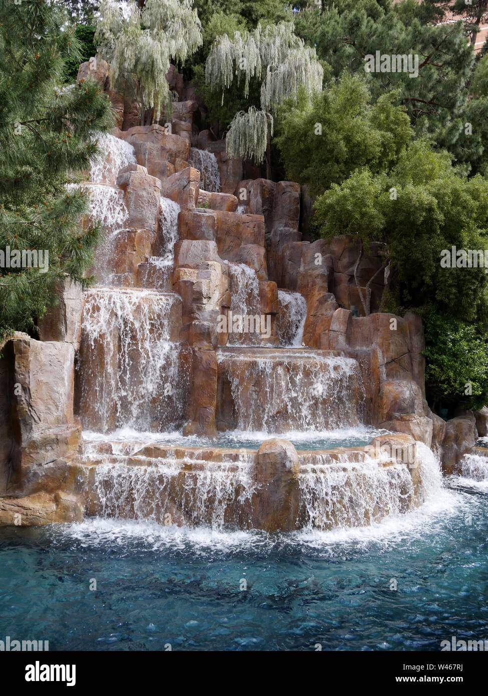 Man-made waterfalls in a landscaped garden Stock Photo - Alamy