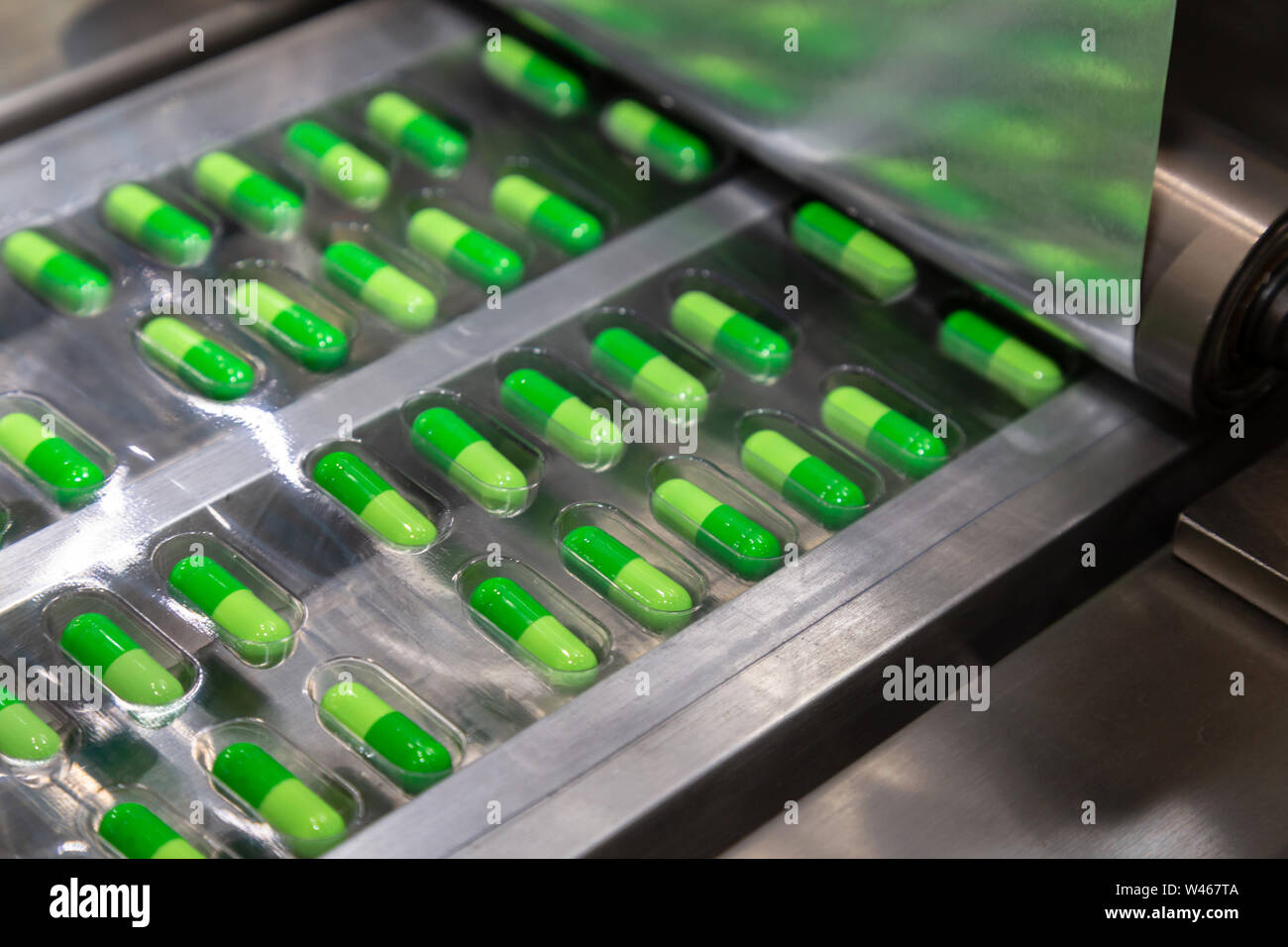 capsule pill ready on medicine aluminum foil packaging in the process ...