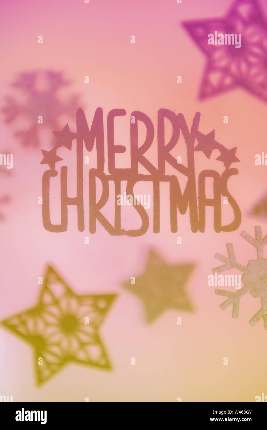 Merry Christmas message with hanging star ornaments Stock Photo - Alamy