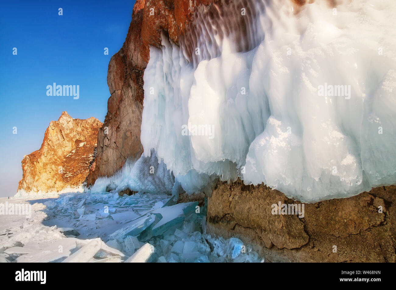 Frozen lake and rocks near the ice cave Stock Photo - Alamy