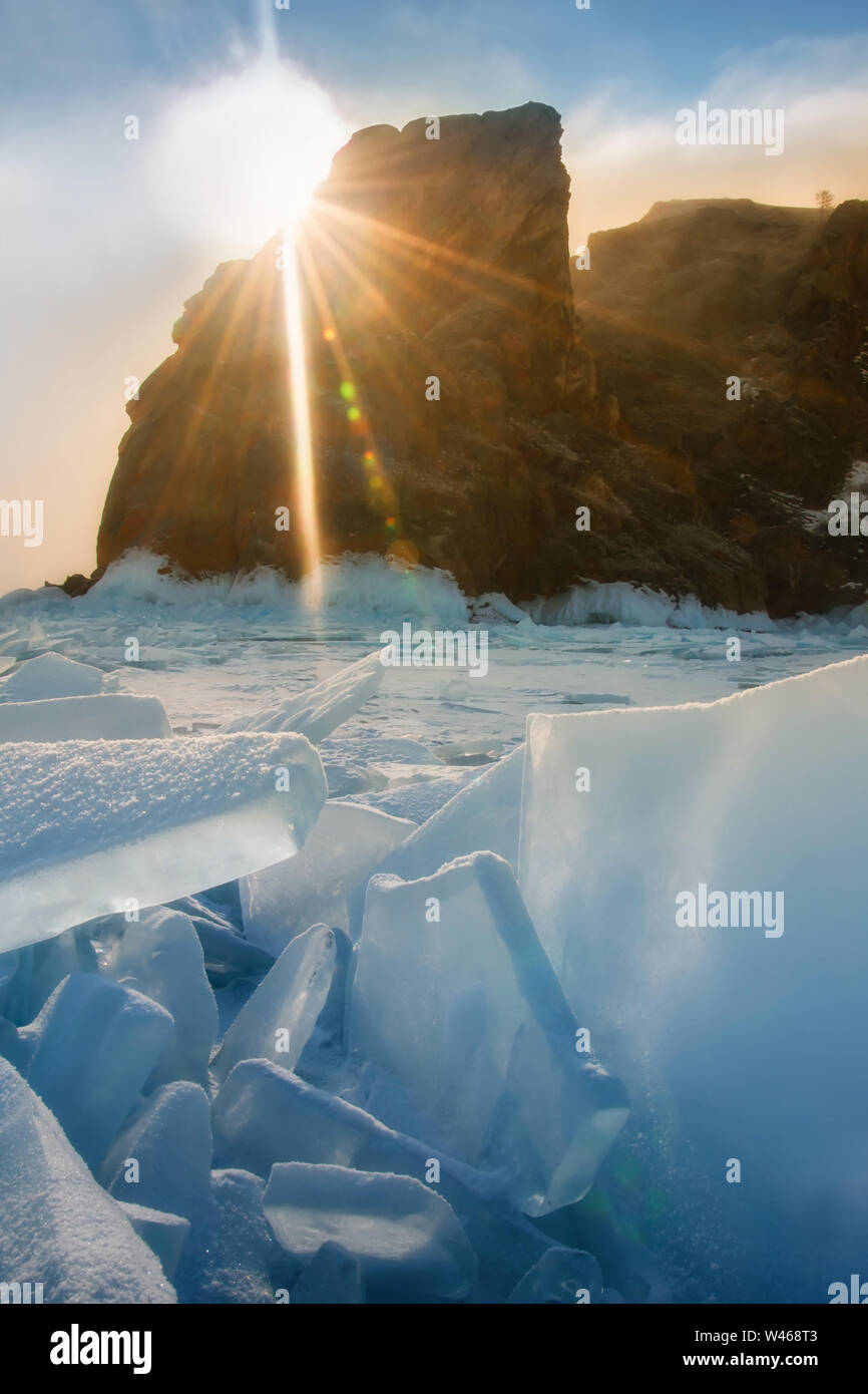 Field of blue ice and rocks with sun Stock Photo - Alamy