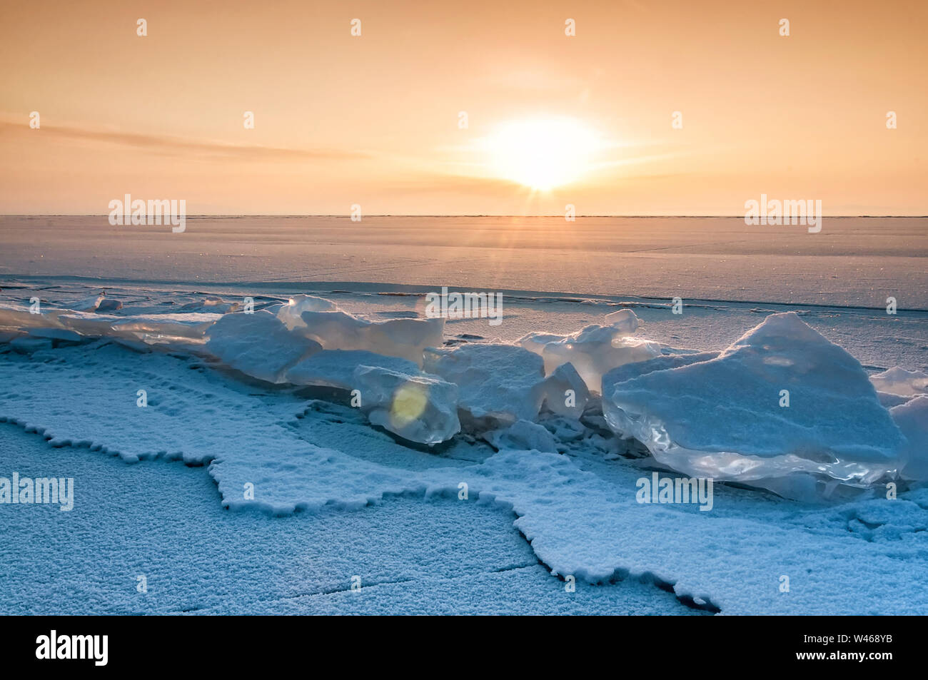 Field of ice hummocks on the frozen Lake Baikal. Sunset Stock Photo - Alamy