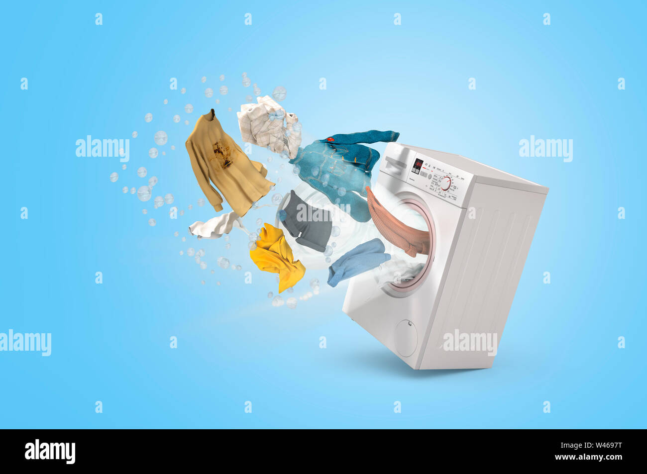 Washing machine and flying clothes on blue background Stock Photo - Alamy