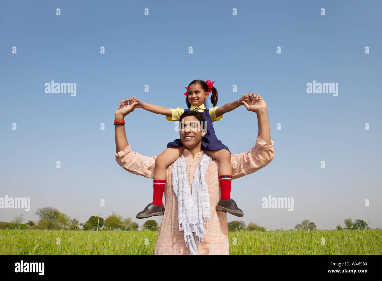 India man carrying child hi-res stock photography and images - Alamy