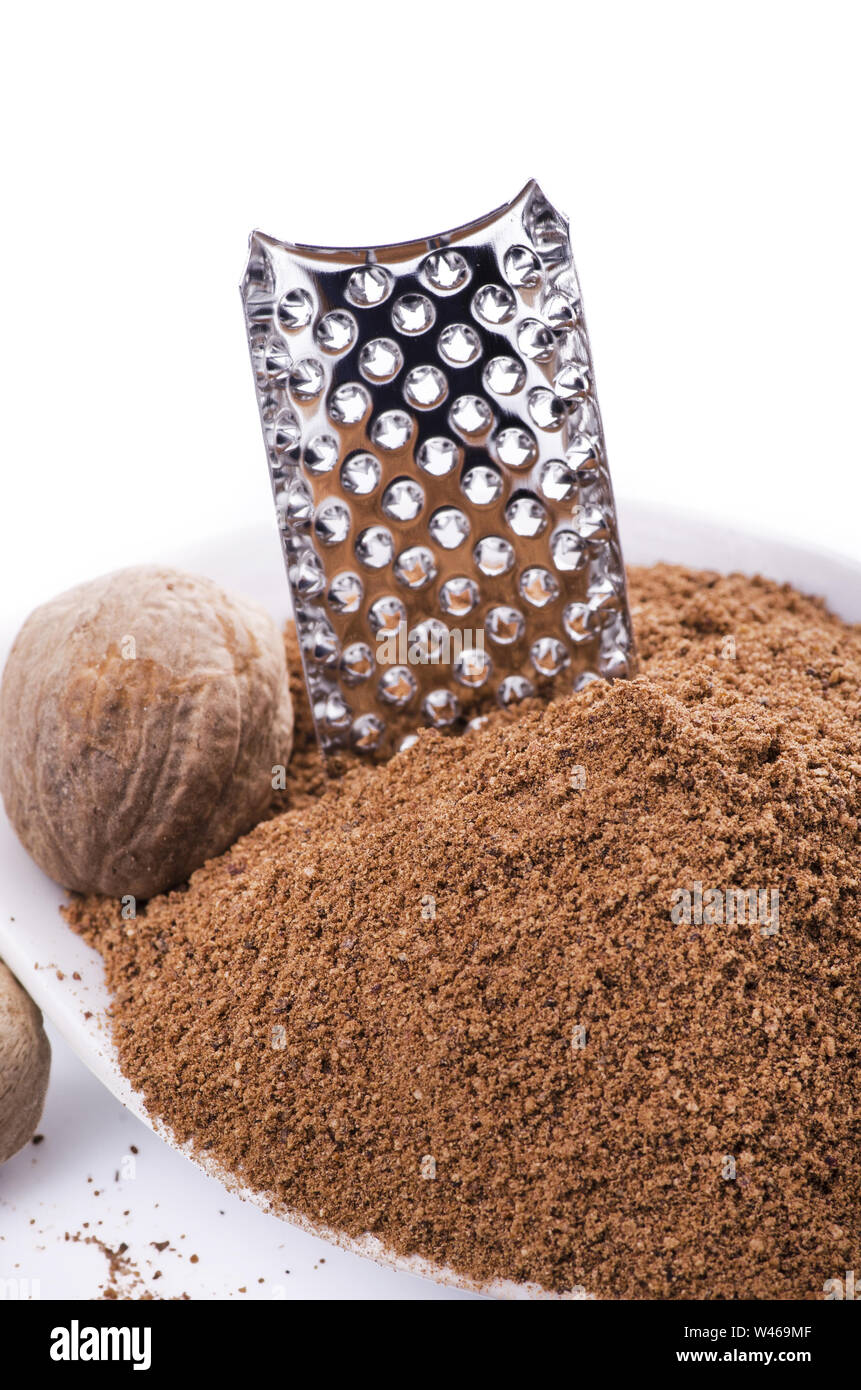pile of grated nutmeg isolated from the white background Stock Photo ...