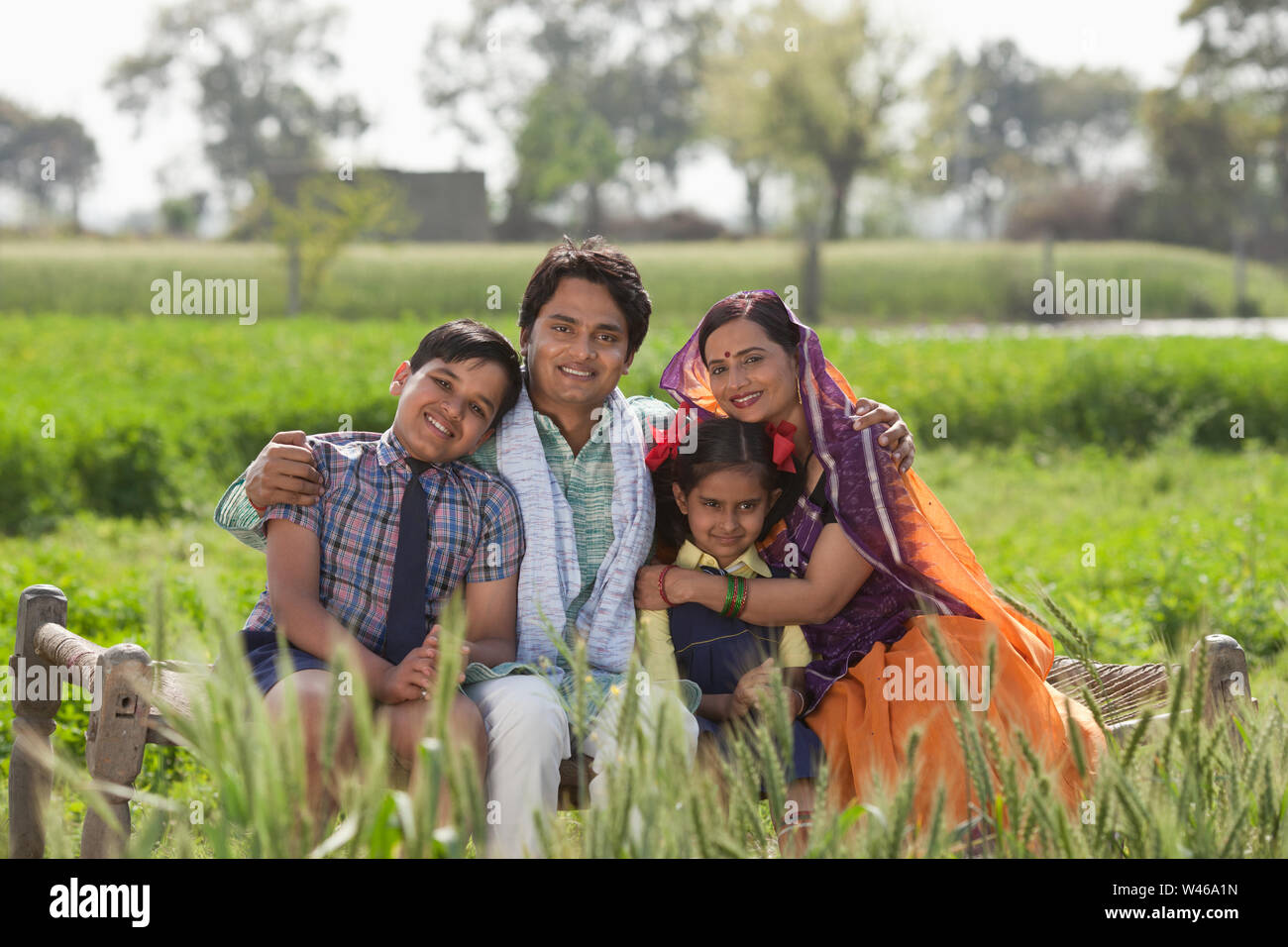 Rural family smiling Stock Photo - Alamy