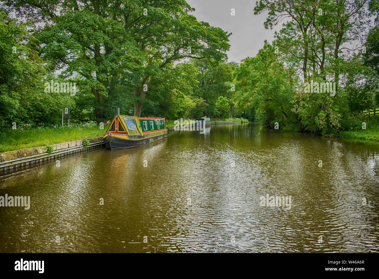 Narrowboats moored up in English rural countryside scenery on British ...
