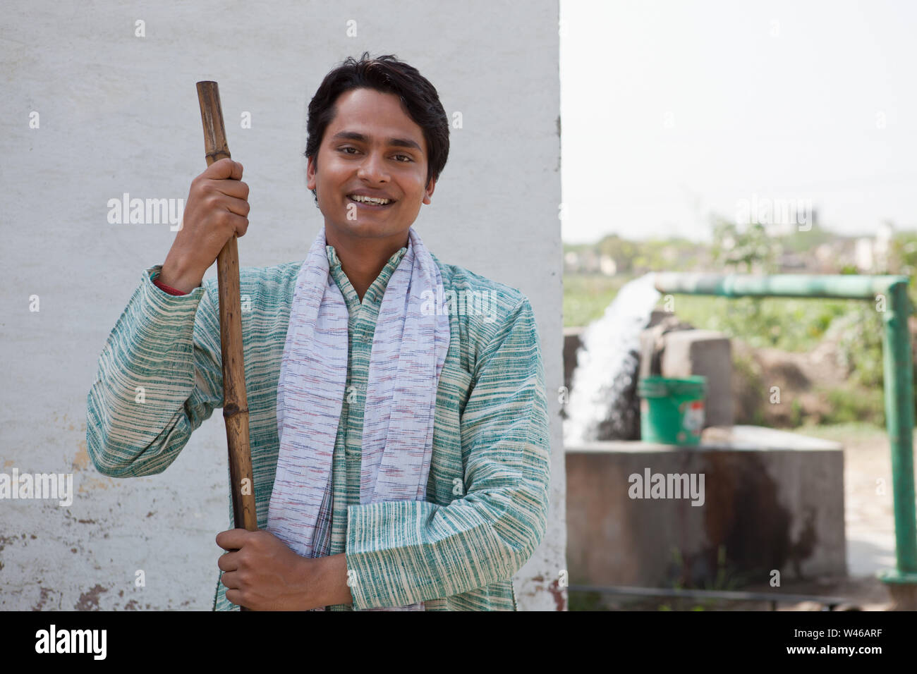 Portrait of a farmer smiling Stock Photo - Alamy