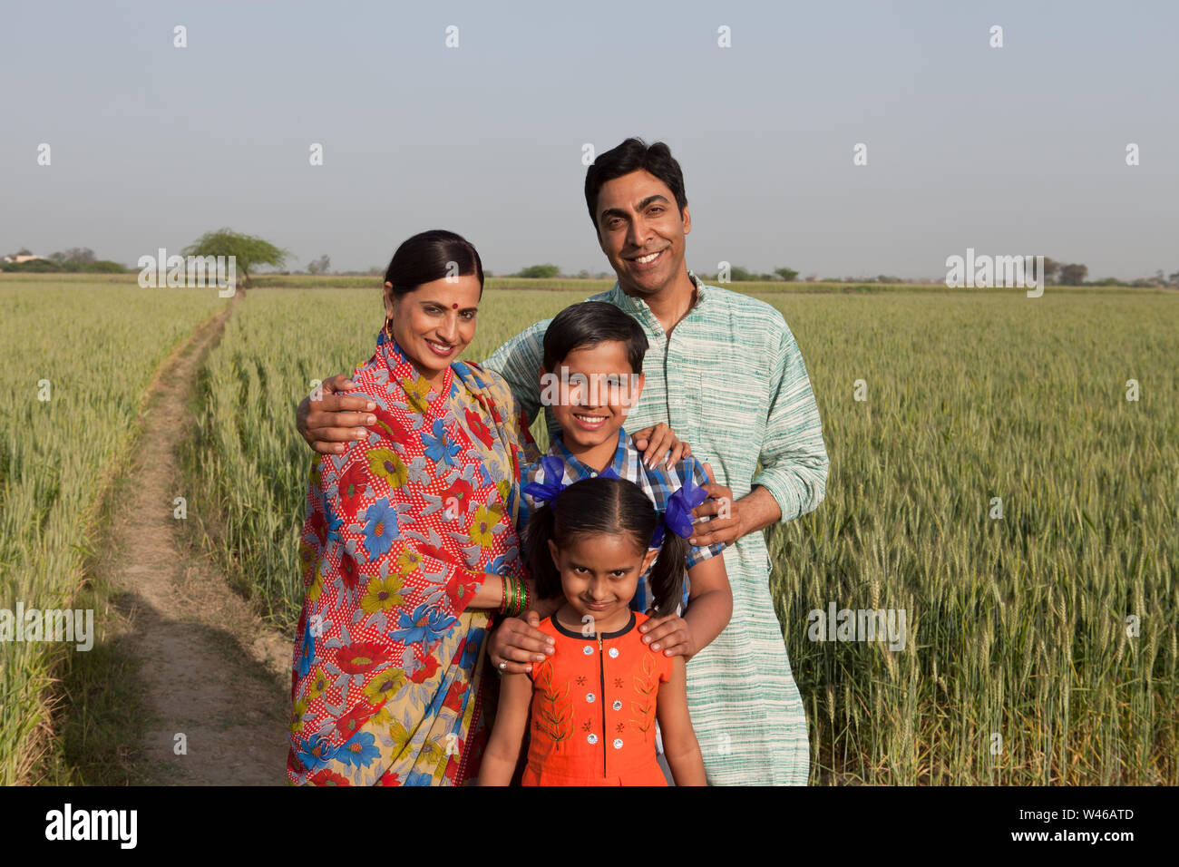 Rural family standing in a field Stock Photo - Alamy