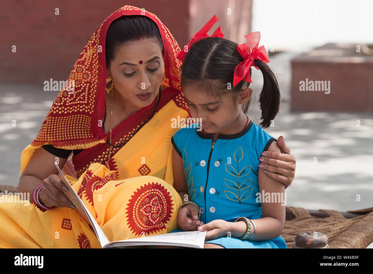 Woman teaching her daughter Stock Photo - Alamy