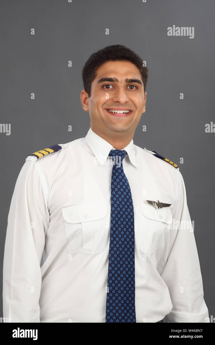 Portrait of a pilot smiling Stock Photo - Alamy