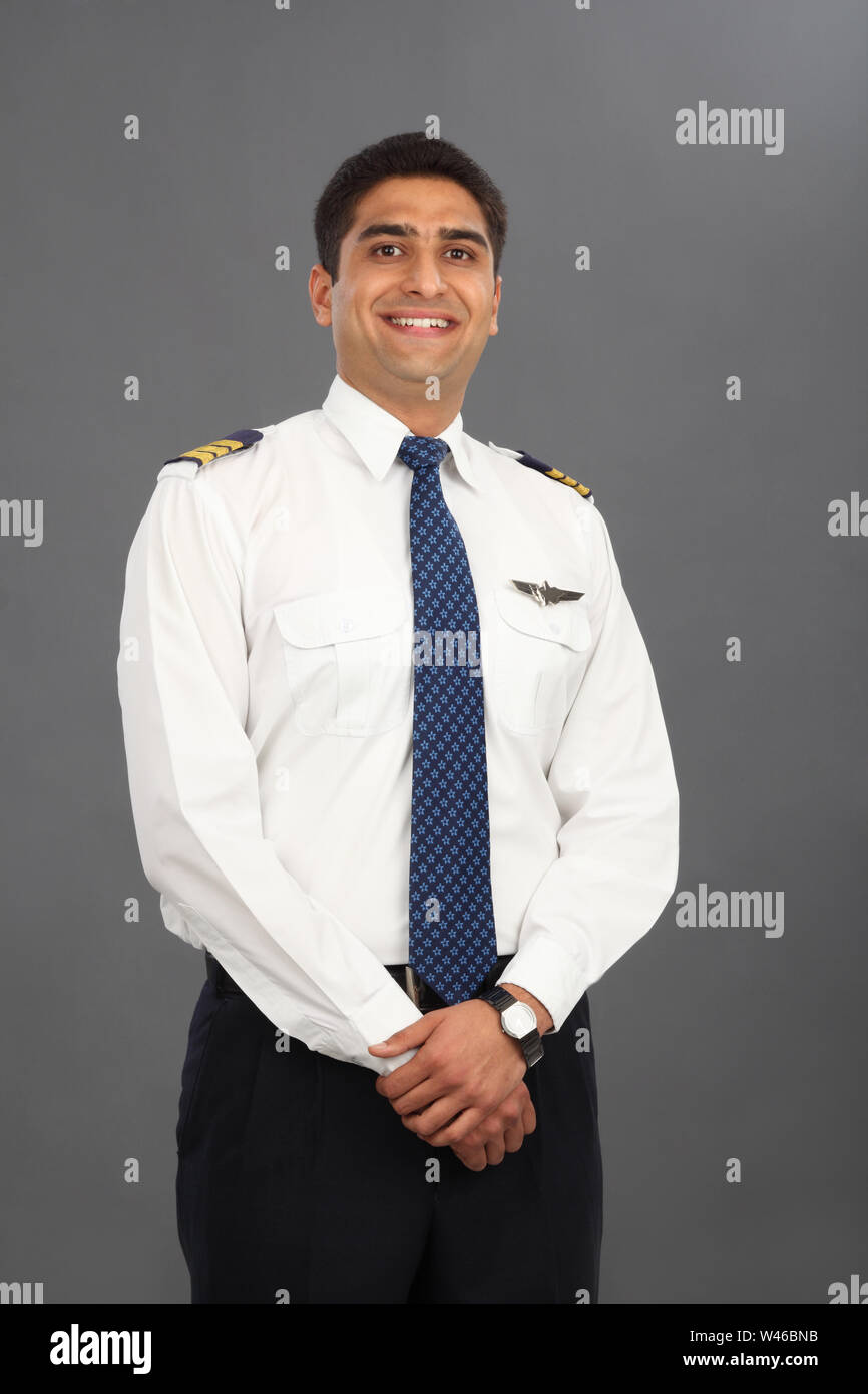 Portrait of a pilot smiling Stock Photo - Alamy