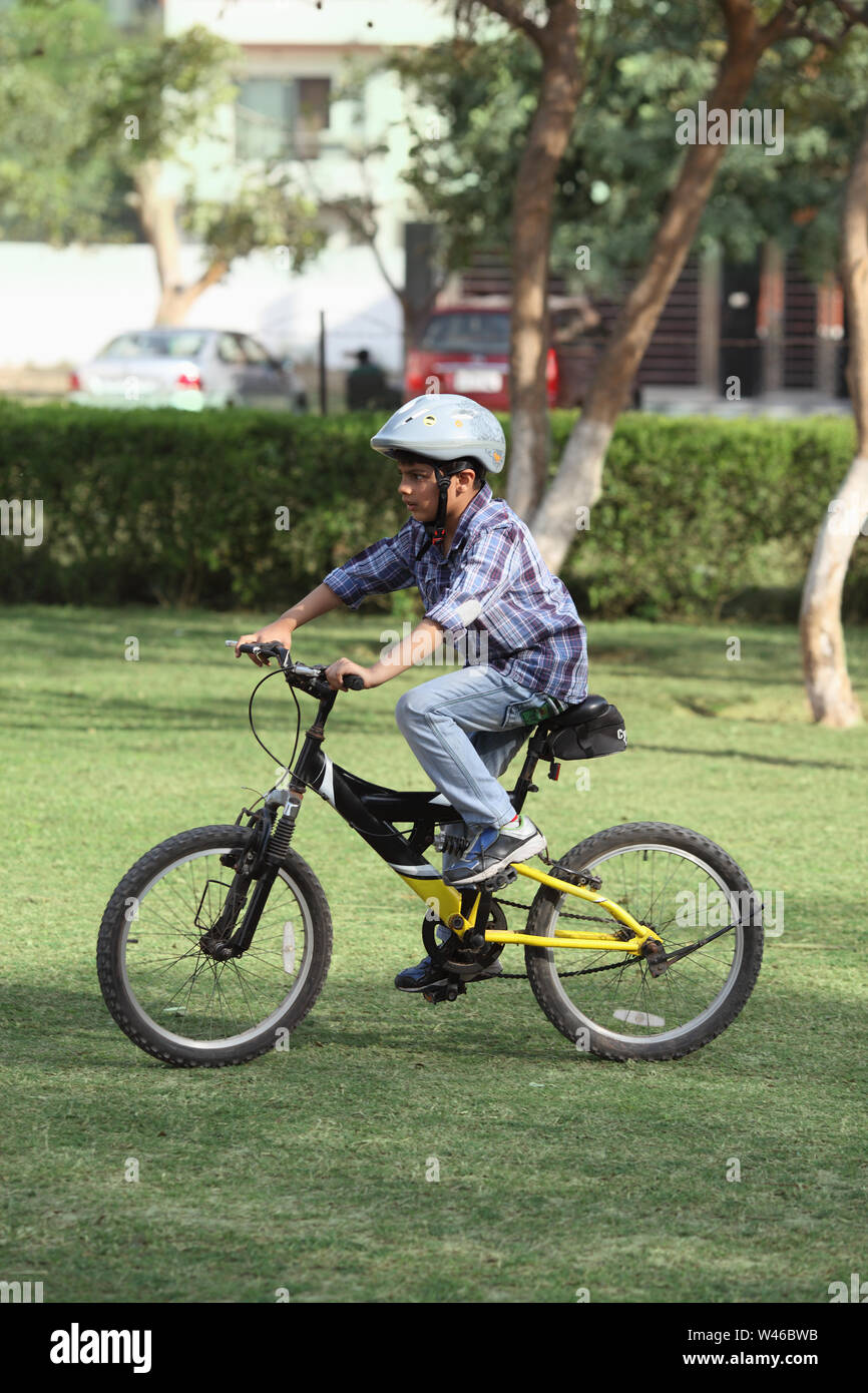 Indian boy on cycle hi-res stock photography and images - Alamy