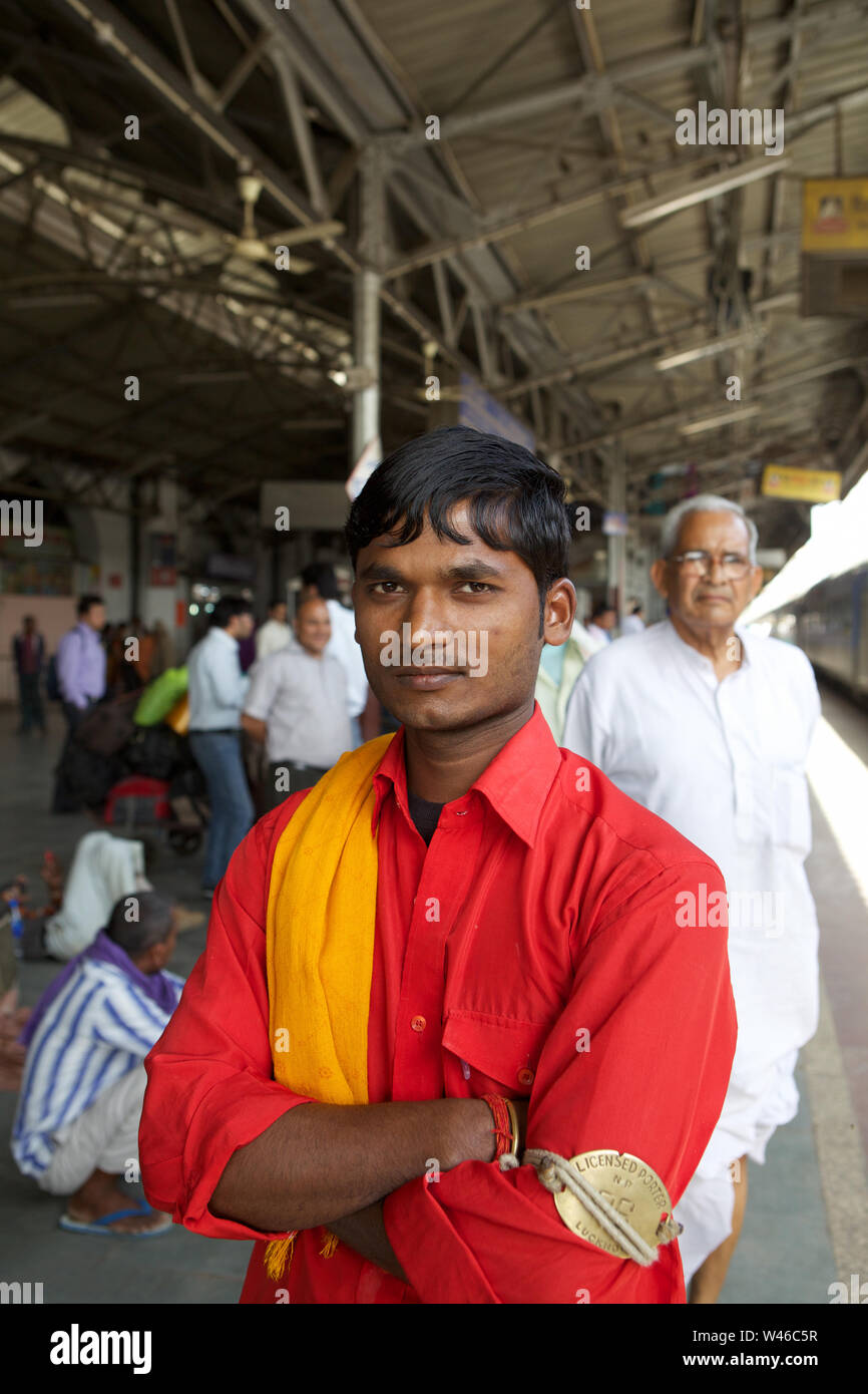 Portrait of a coolie at a station platform Stock Photo - Alamy