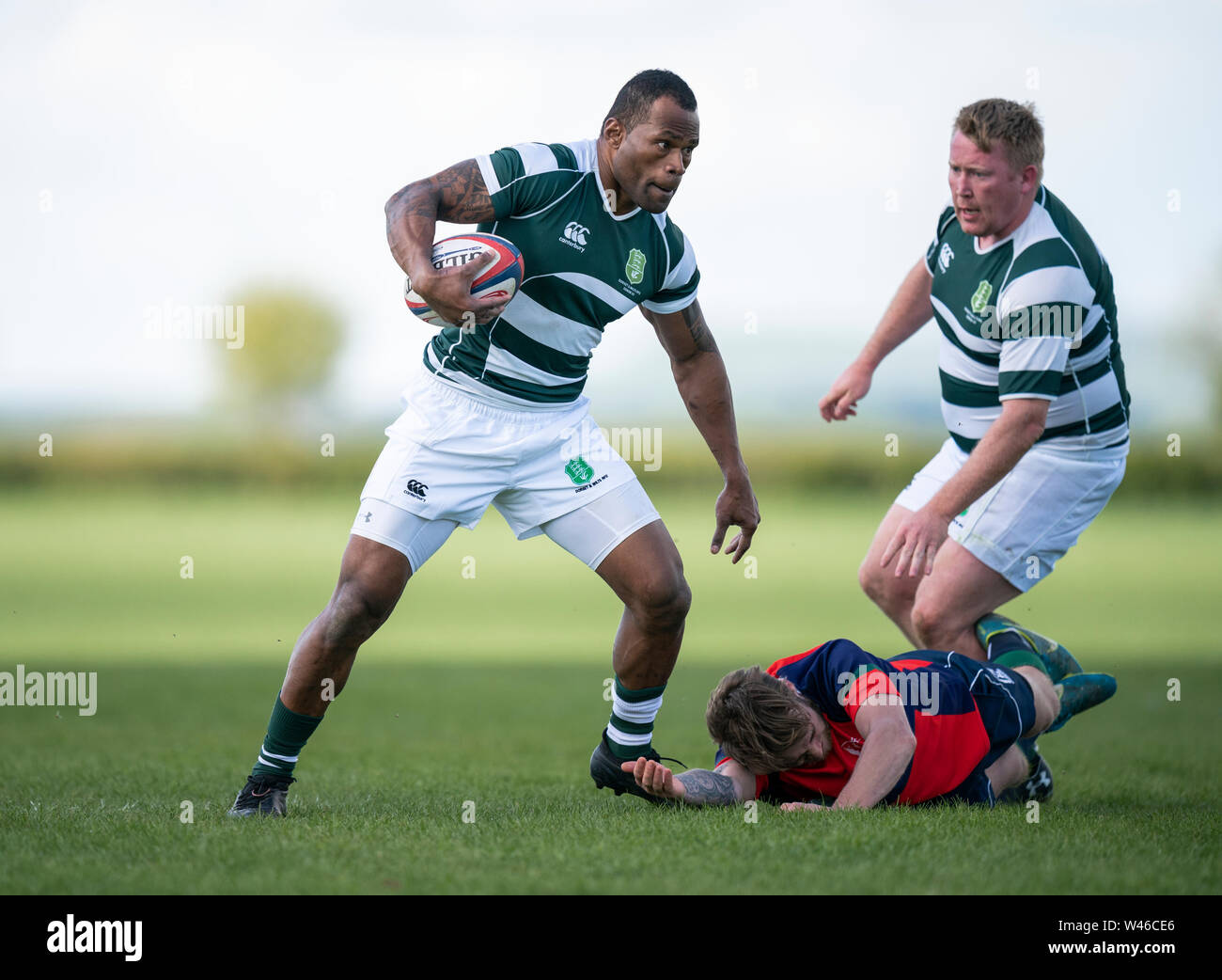 Rugby players in action Stock Photo - Alamy
