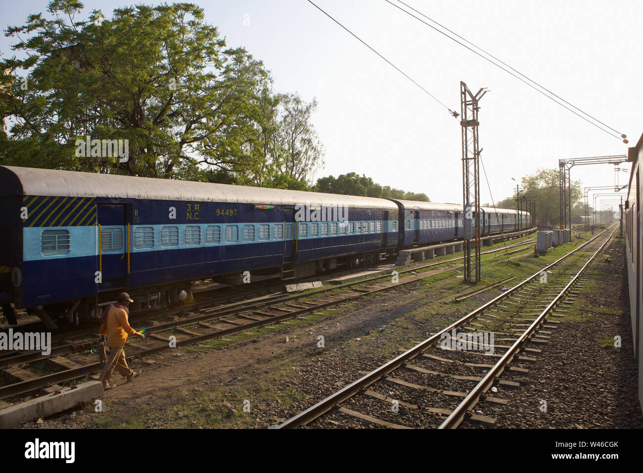 Train on railroad track Stock Photo - Alamy