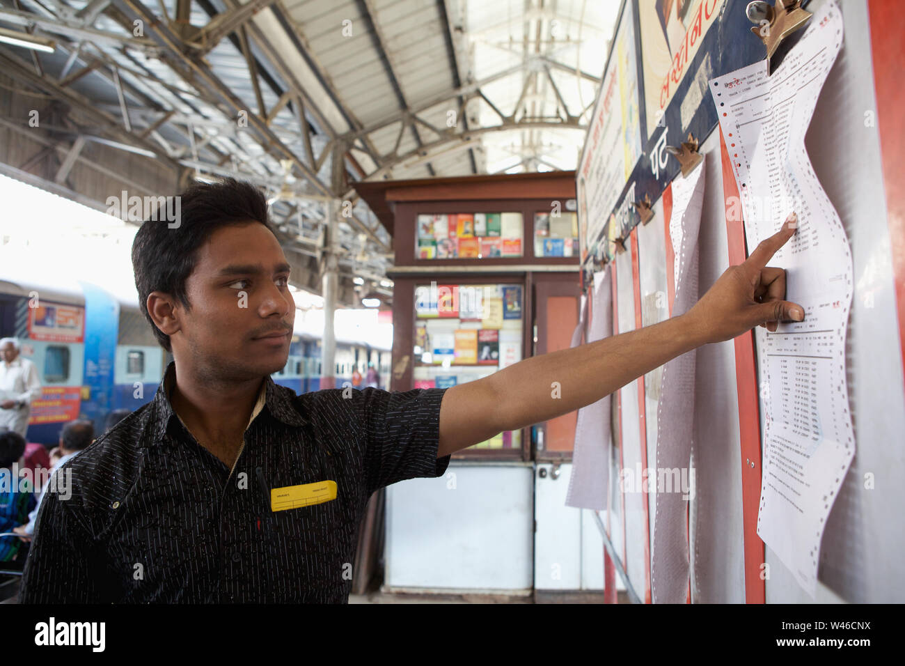 Passenger checking reservation status at a platform, Lucknow, Uttar ...