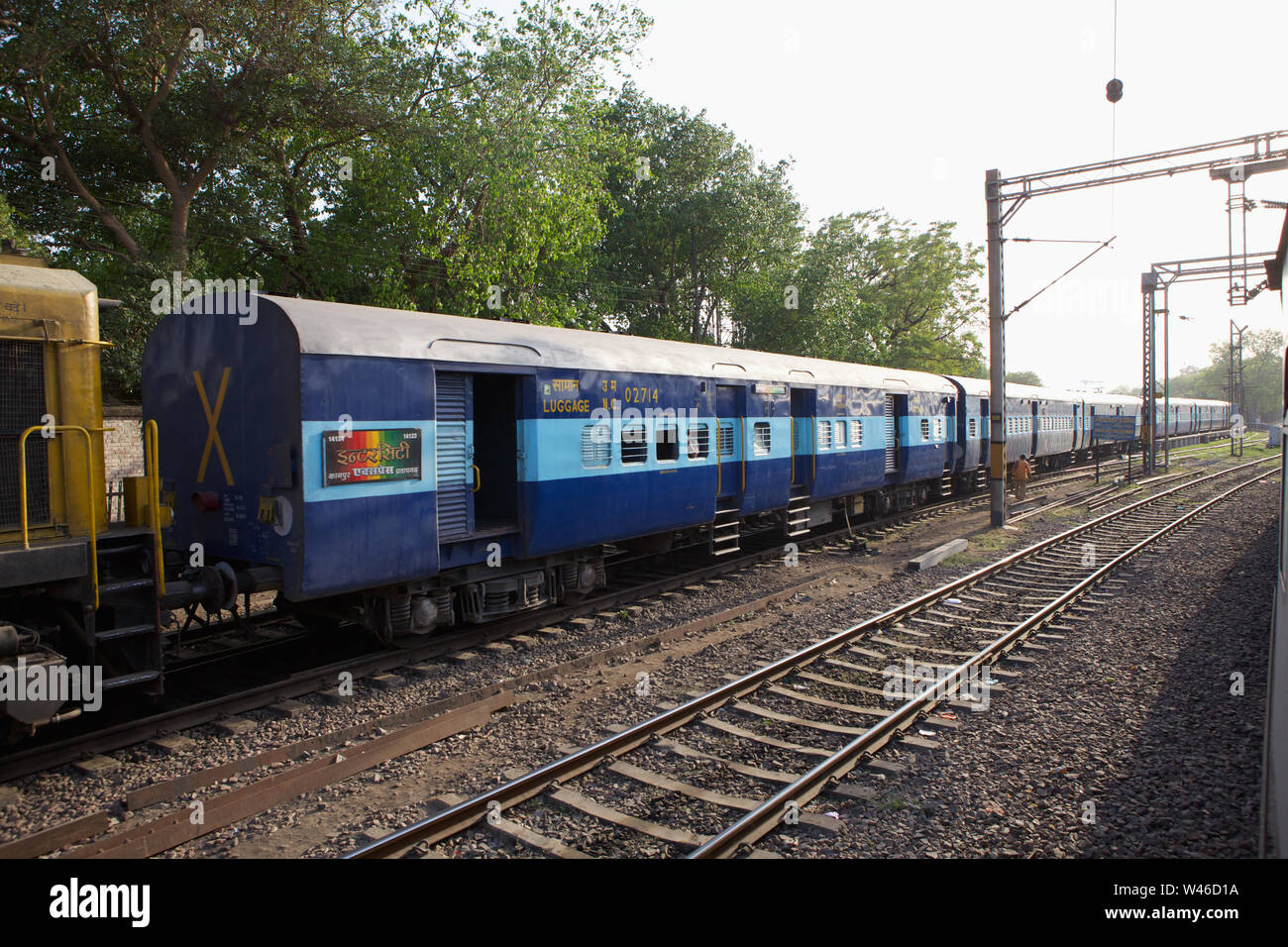 Train on railroad track Stock Photo - Alamy