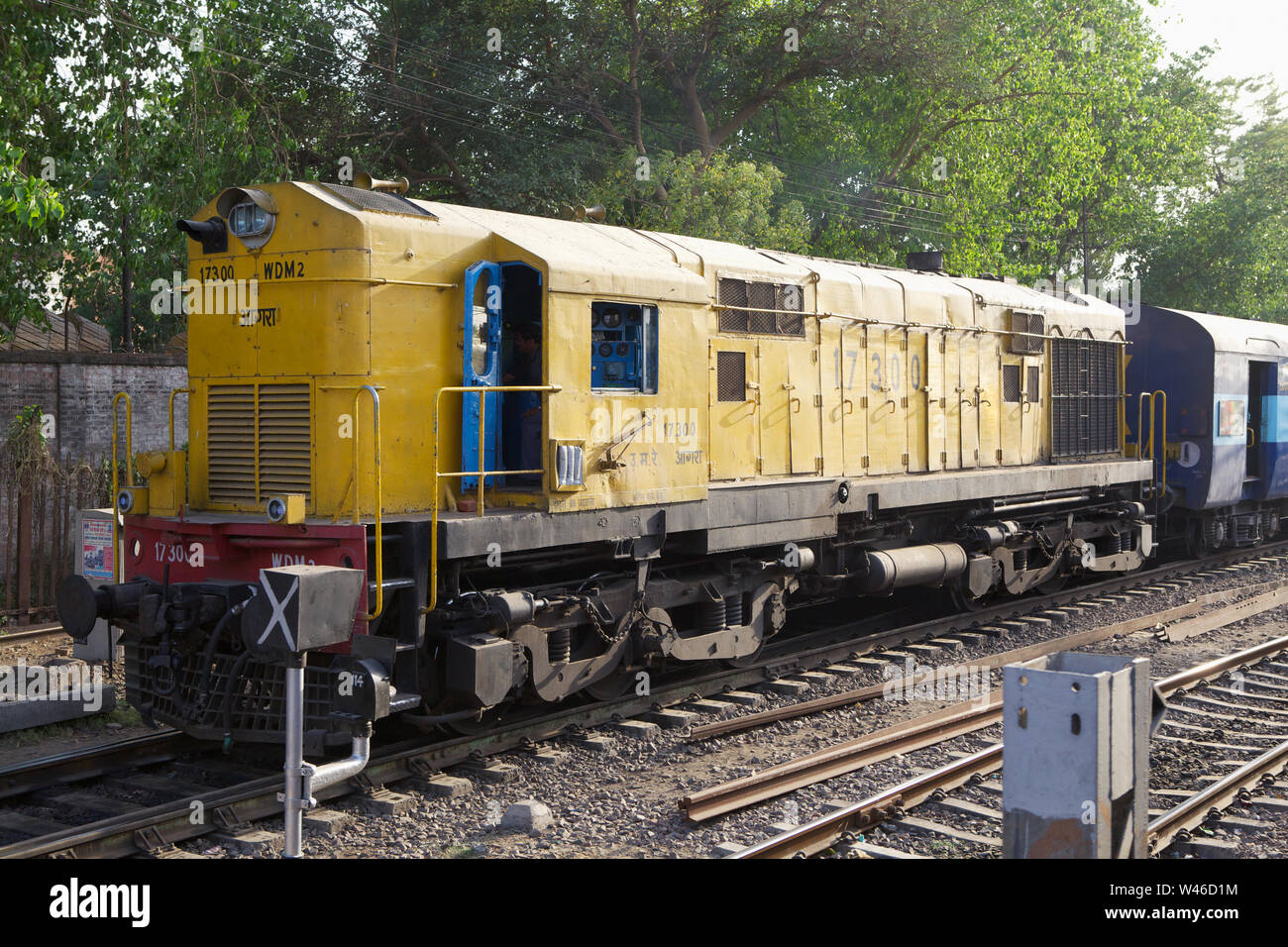 Train on railroad track Stock Photo - Alamy