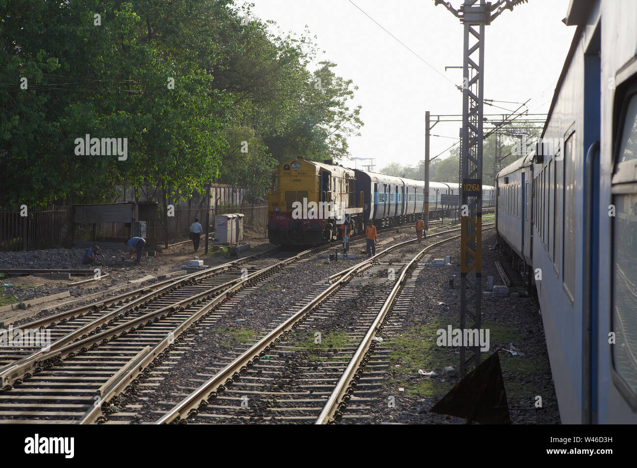 Trains on railroad track Stock Photo - Alamy