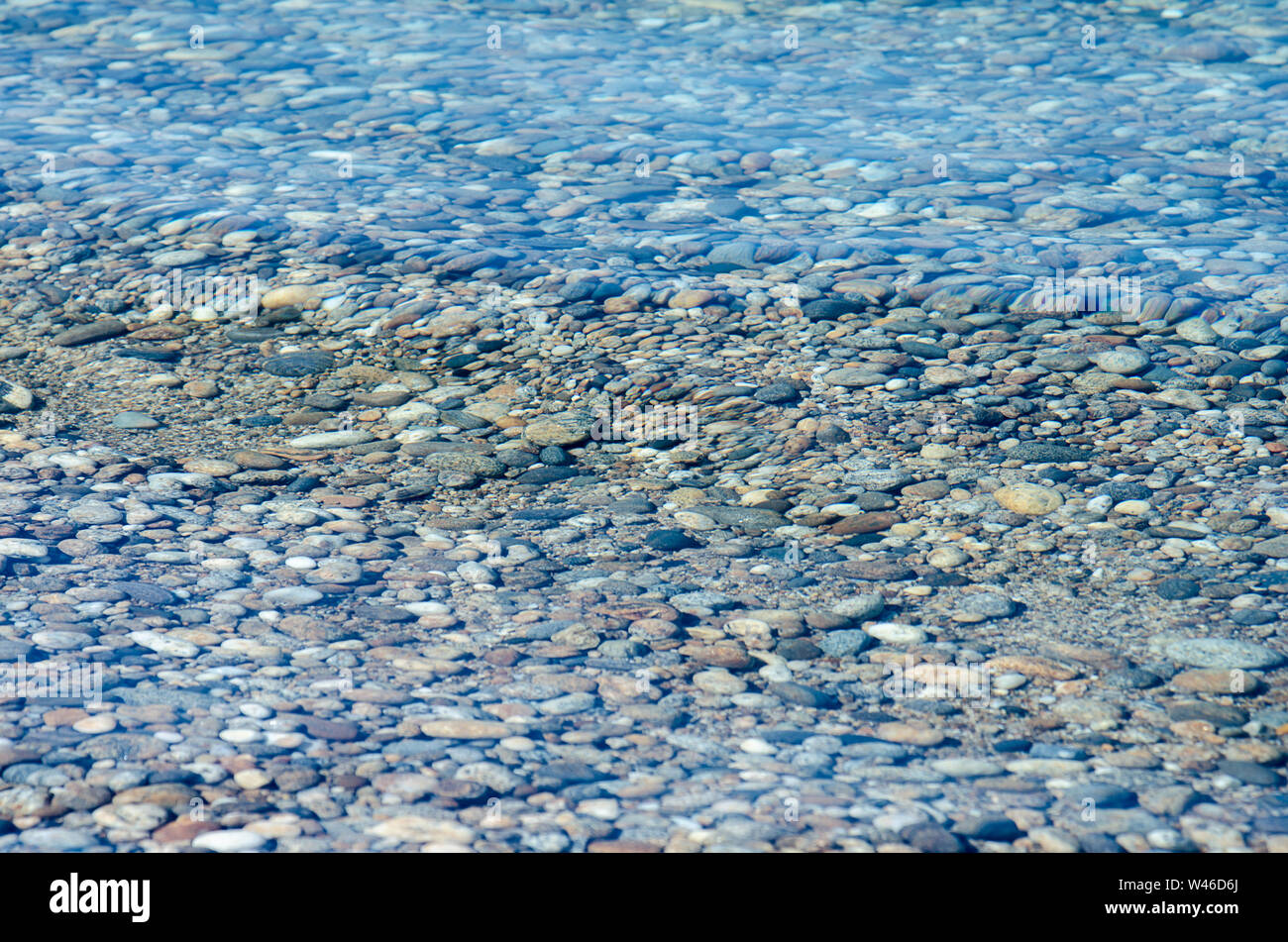 pebble stones into the water Stock Photo - Alamy