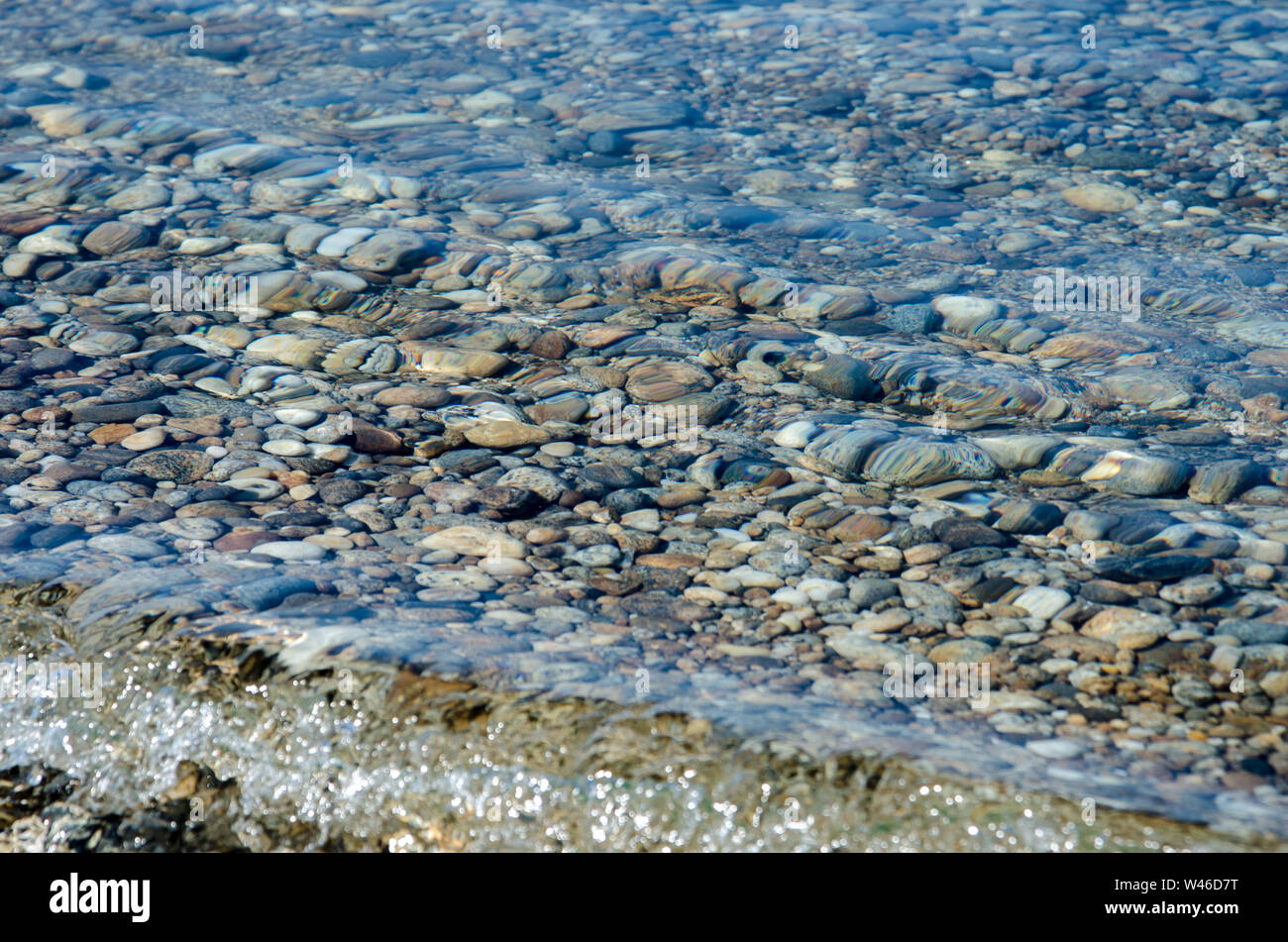 pebble stones into the water Stock Photo - Alamy
