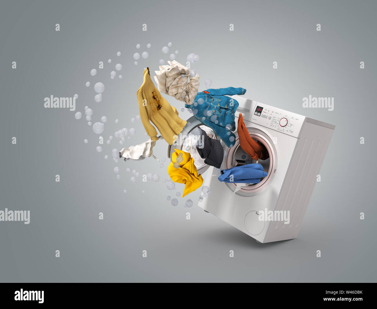 Washing machine and flying clothes on grey background Stock Photo - Alamy