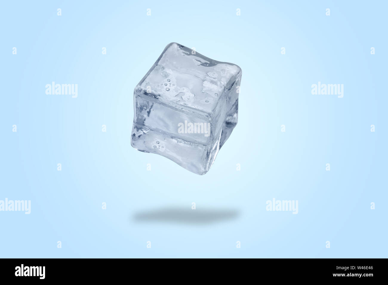 levitating ice cube over blue background, ingredient for summer soft ...
