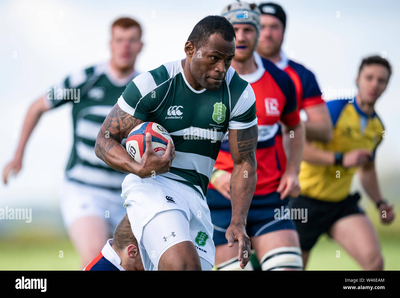 Rugby players in action Stock Photo - Alamy
