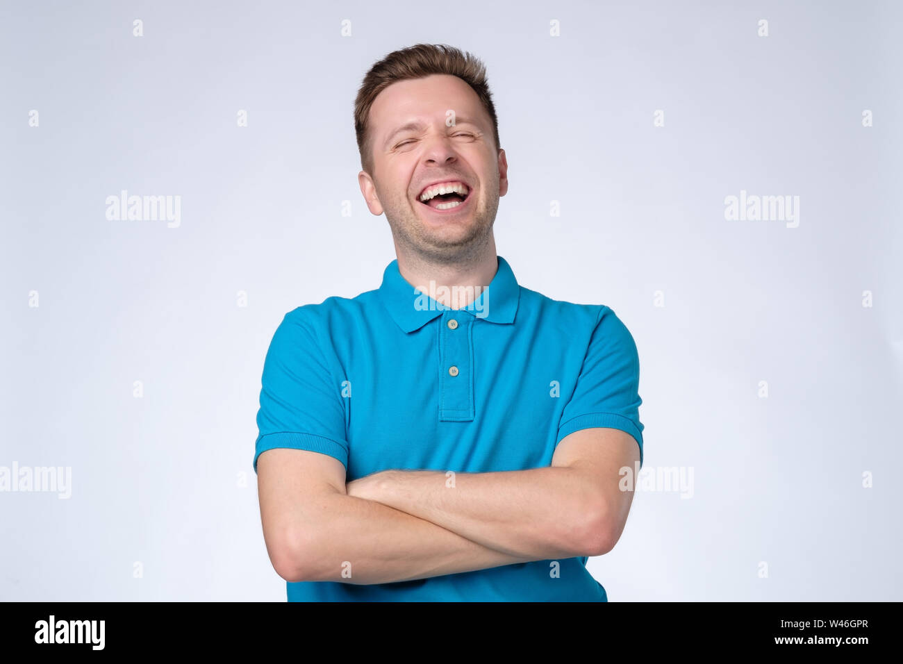 Joyful handsome guy laughing hi-res stock photography and images - Alamy
