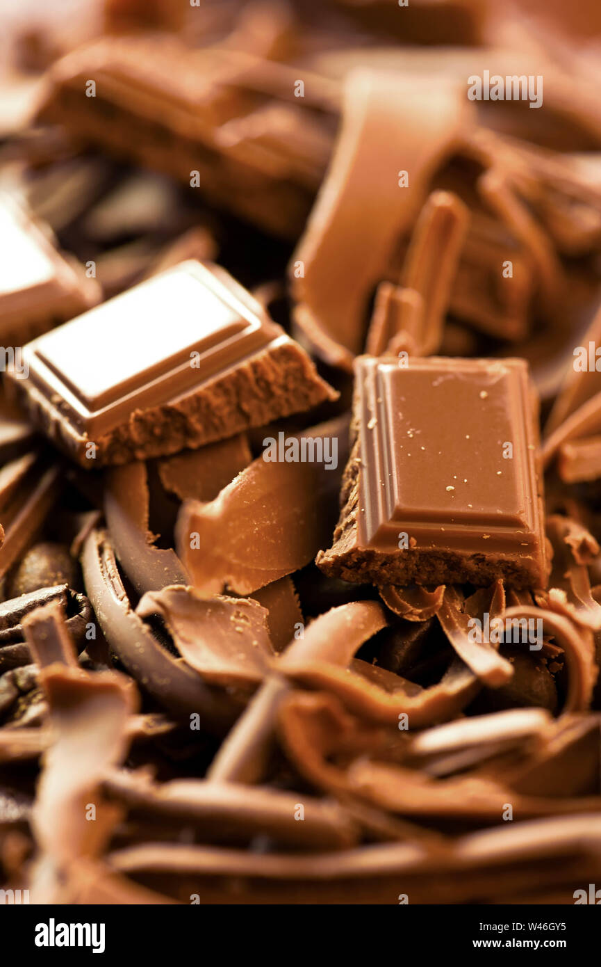 Chocolate background. Bars and strips of chocolate. Shallow depth of ...
