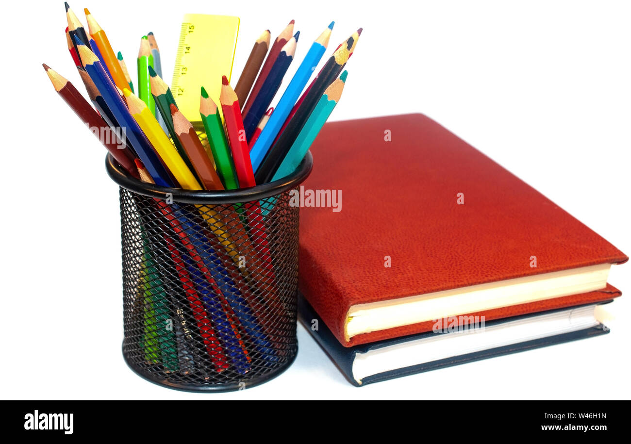 Color pencils and books isolated on white background Stock Photo - Alamy
