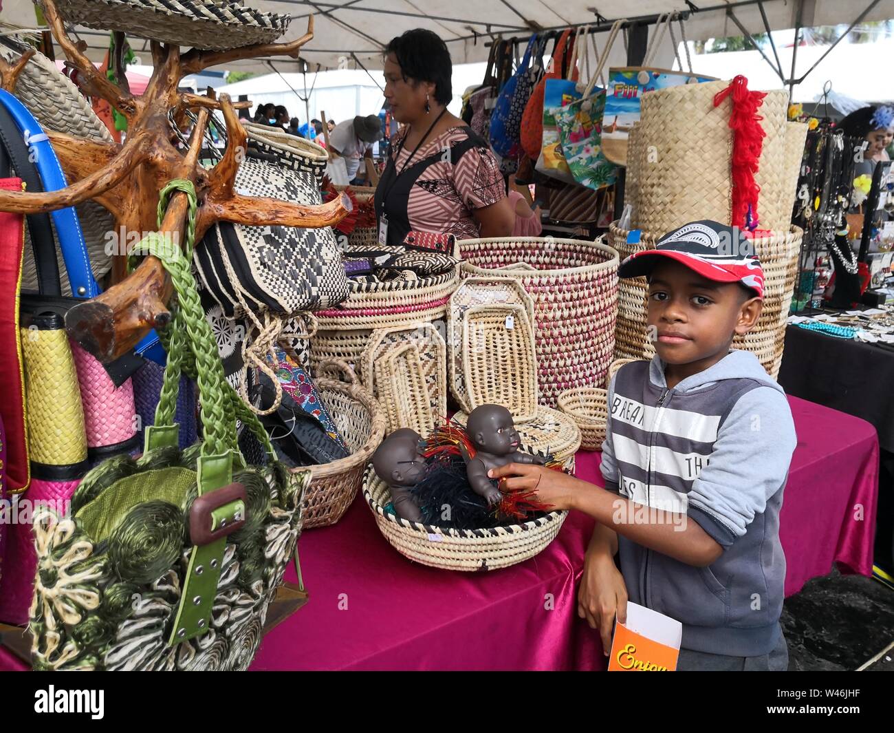 Suva, Fiji. 20th July, 2019. A Fijian child poses for photos near a ...