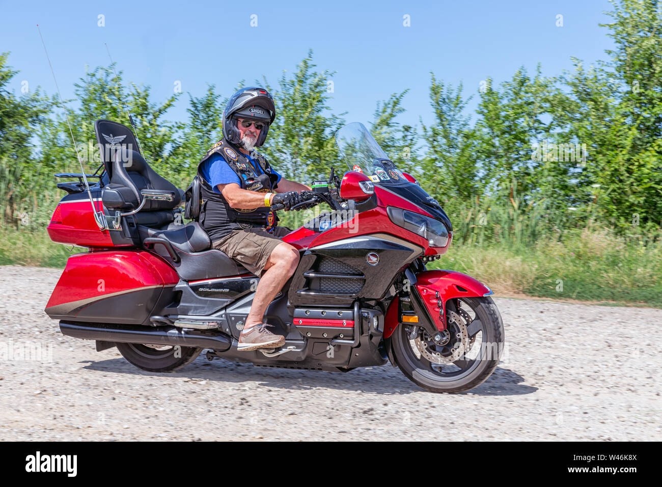 Senior motor biker Honda Goldwing making a drive through Hungary Stock ...