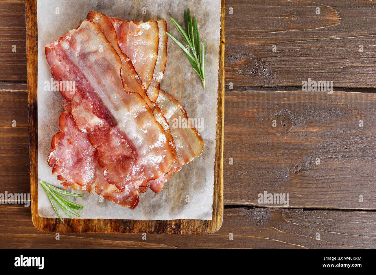 Fried bacon on paper. Top view, flat lay Stock Photo - Alamy