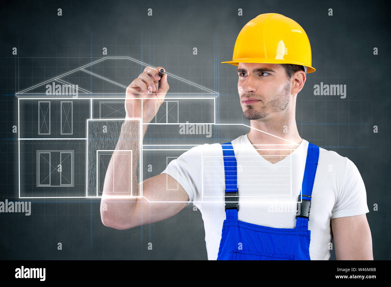 young engineer drawing a plan for a house Stock Photo - Alamy