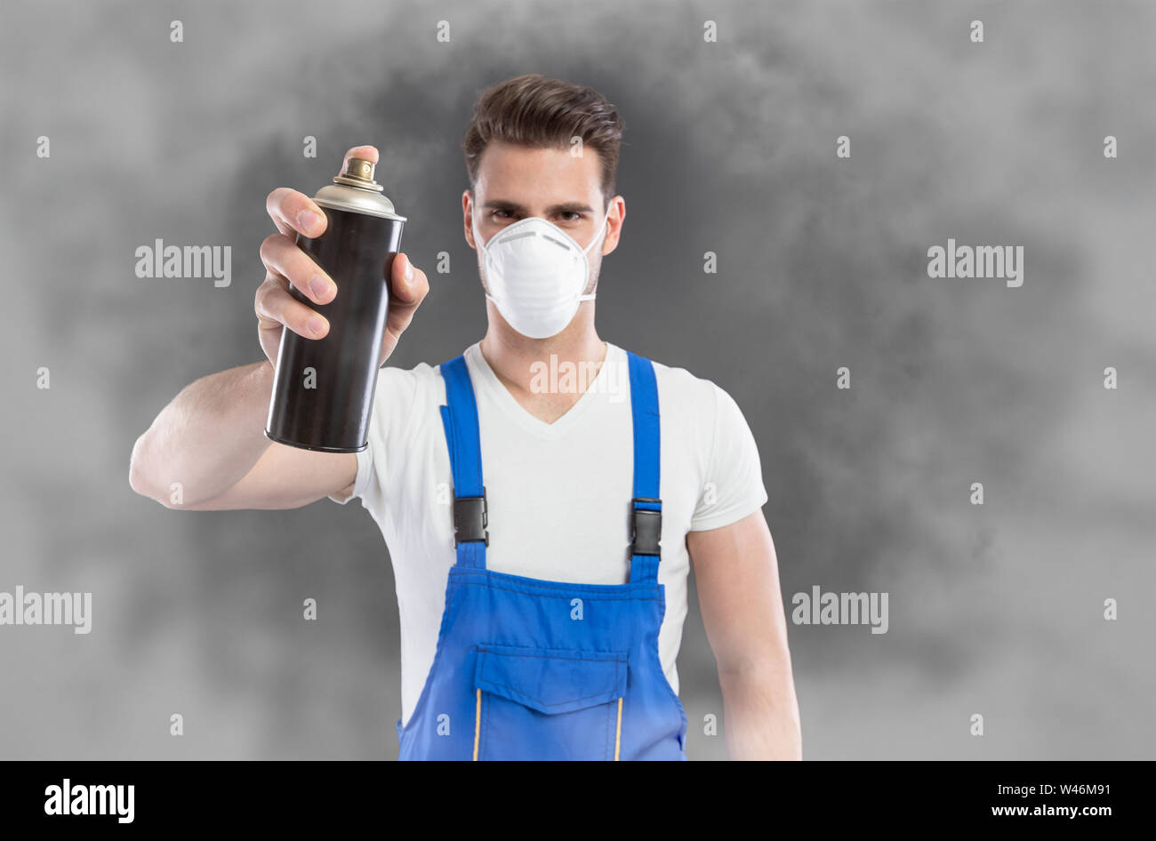 Man with a protective mask over his mouth spray toxic gas Stock Photo ...