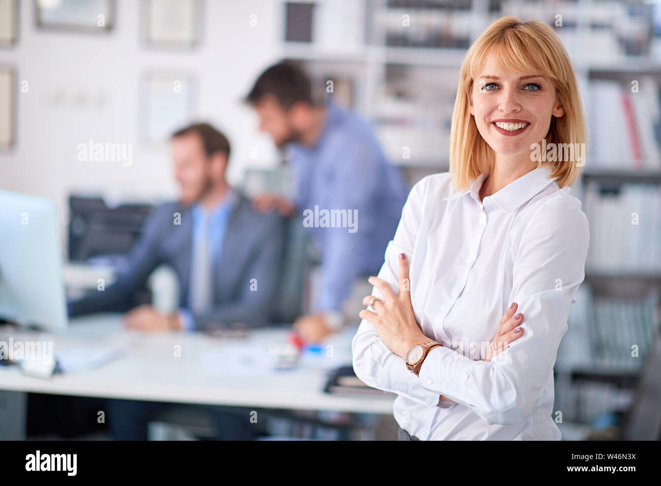 Portrait of successful woman worker at office Stock Photo - Alamy