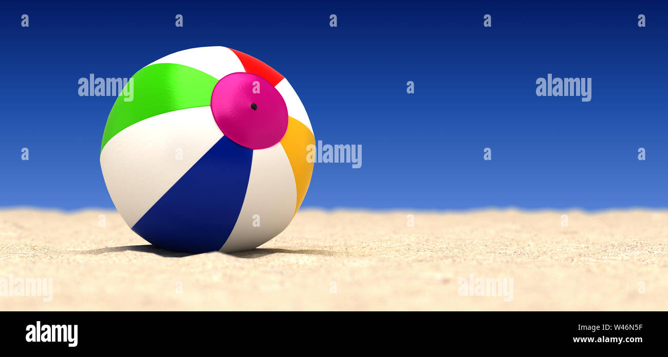 A beach ball on a beach in a sunny day Stock Photo - Alamy