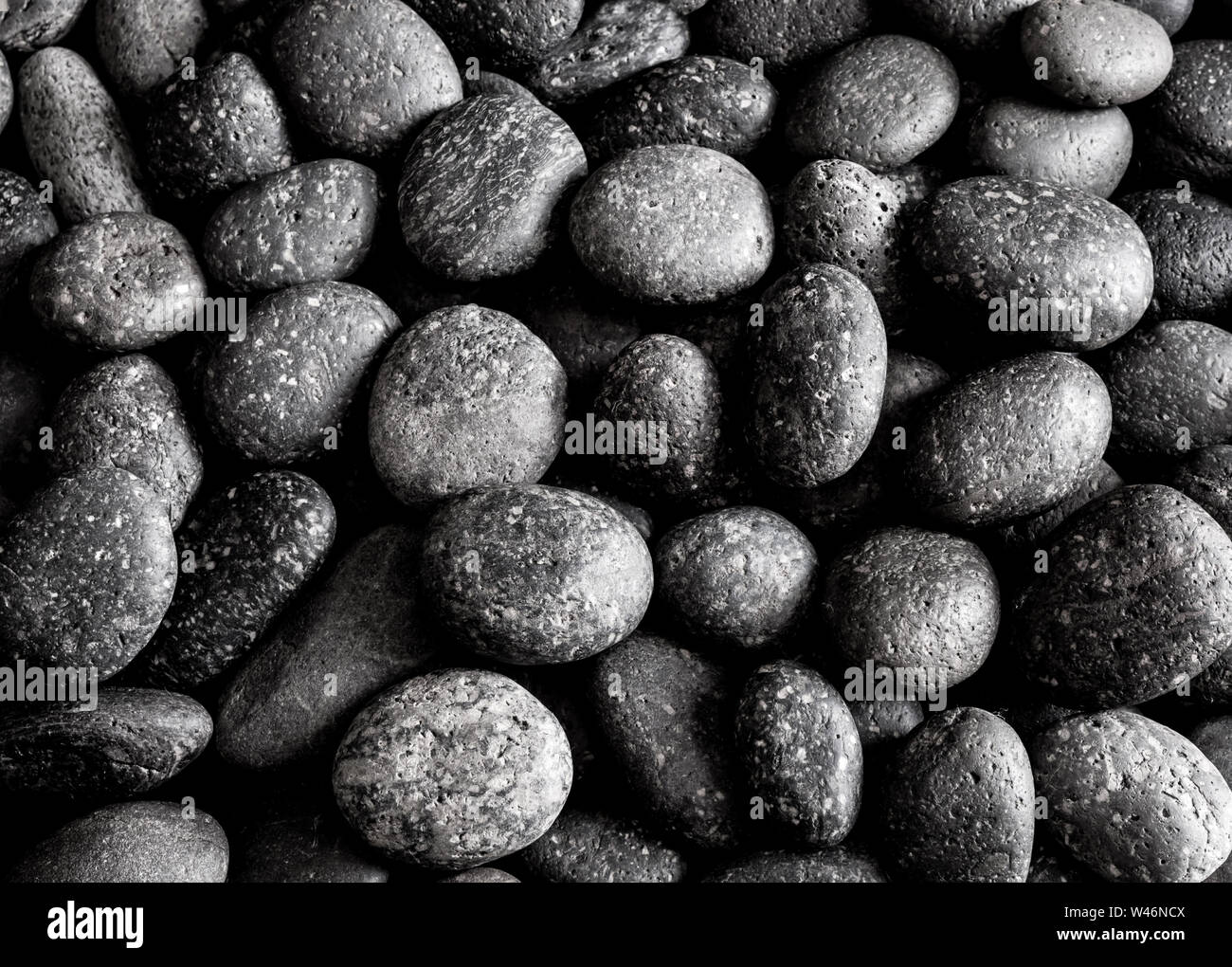 Texture of dried round and spongy black river stone Stock Photo - Alamy
