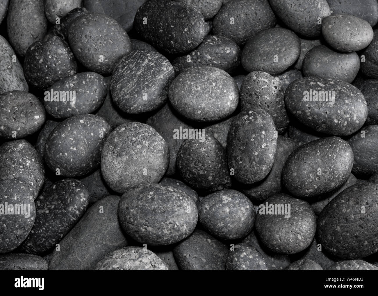 Texture of dried round and spongy black river stone Stock Photo - Alamy
