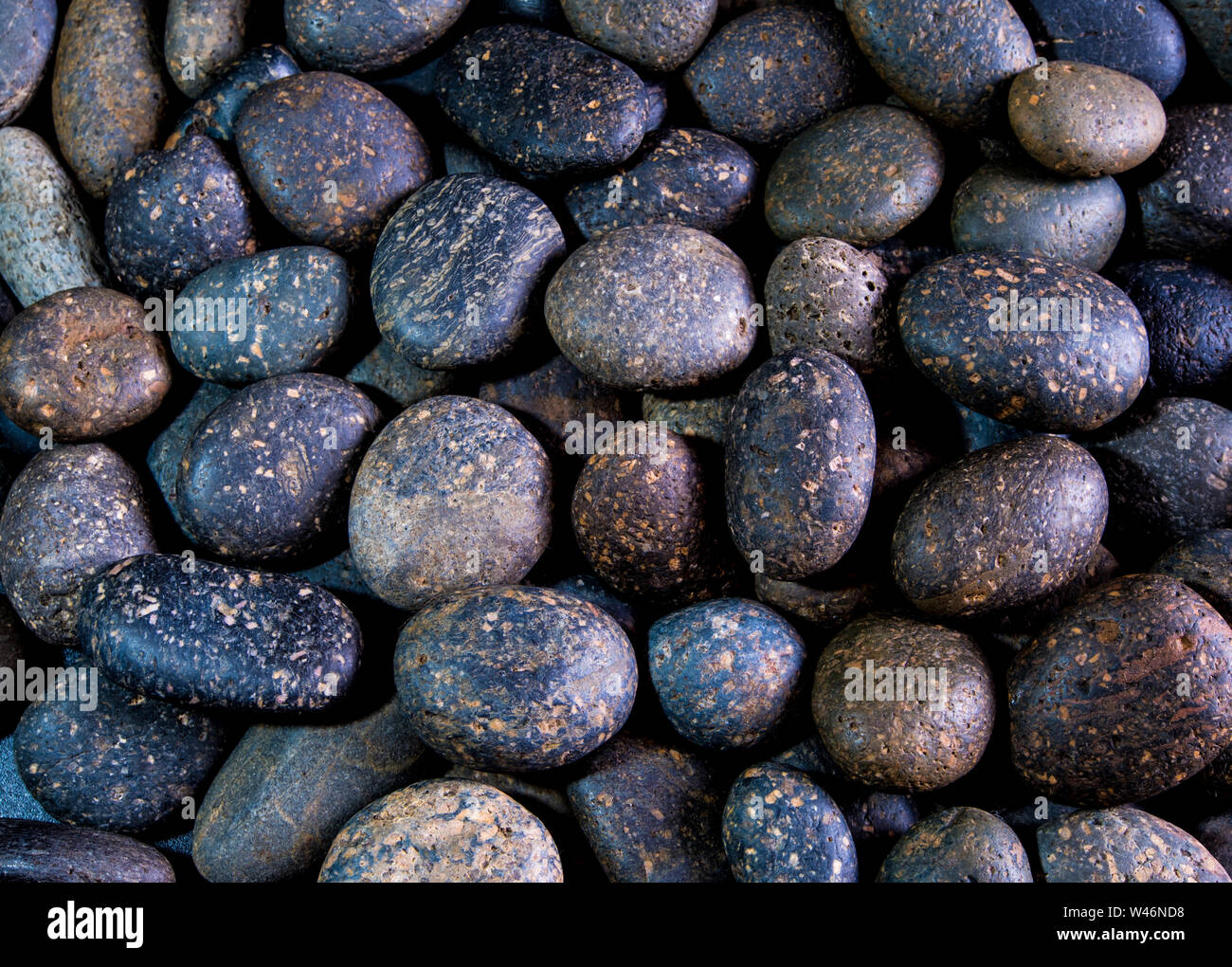 Texture of dried round and spongy black river stone Stock Photo - Alamy
