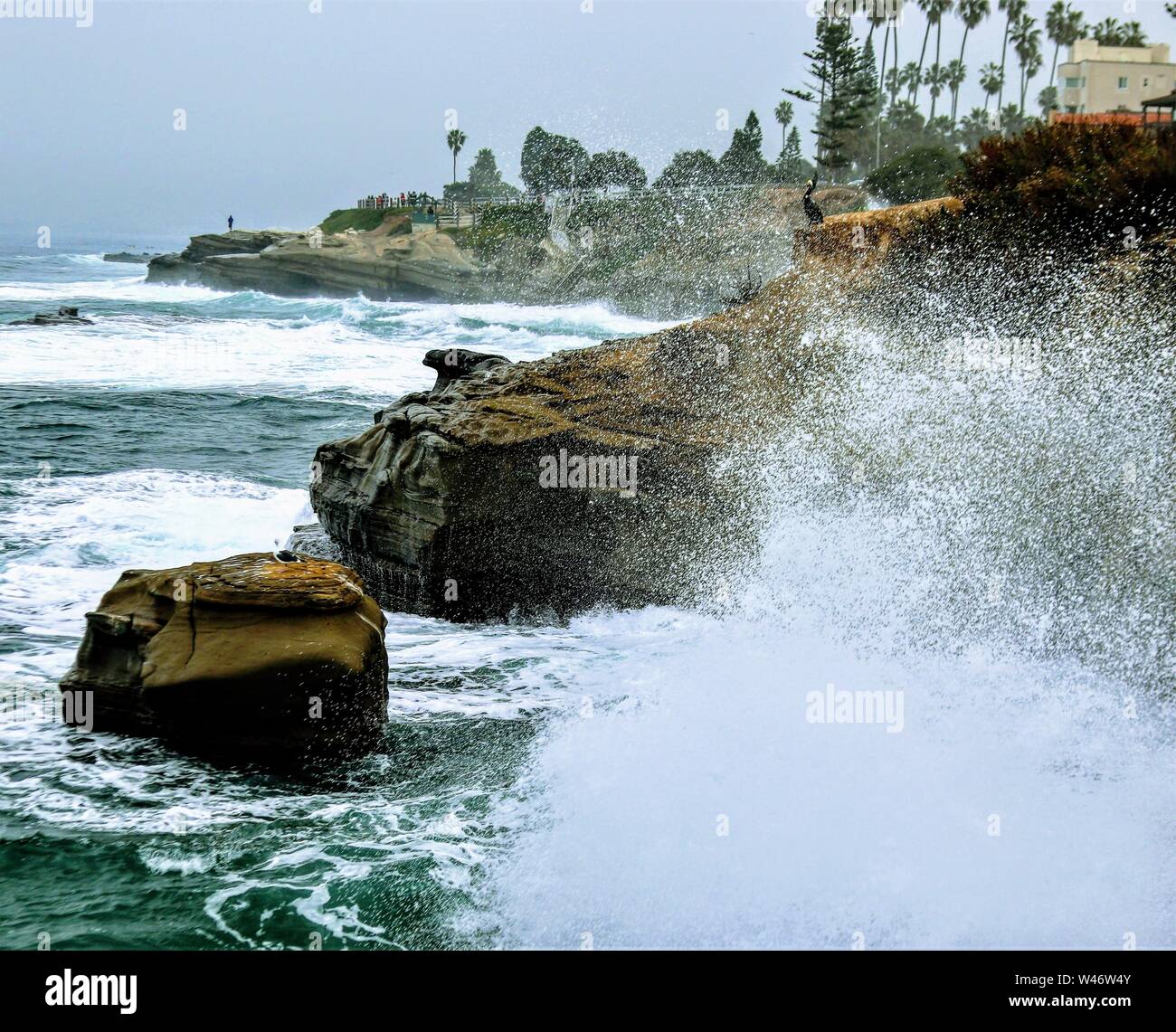 Waves crashing into beach barriers hi-res stock photography and images ...
