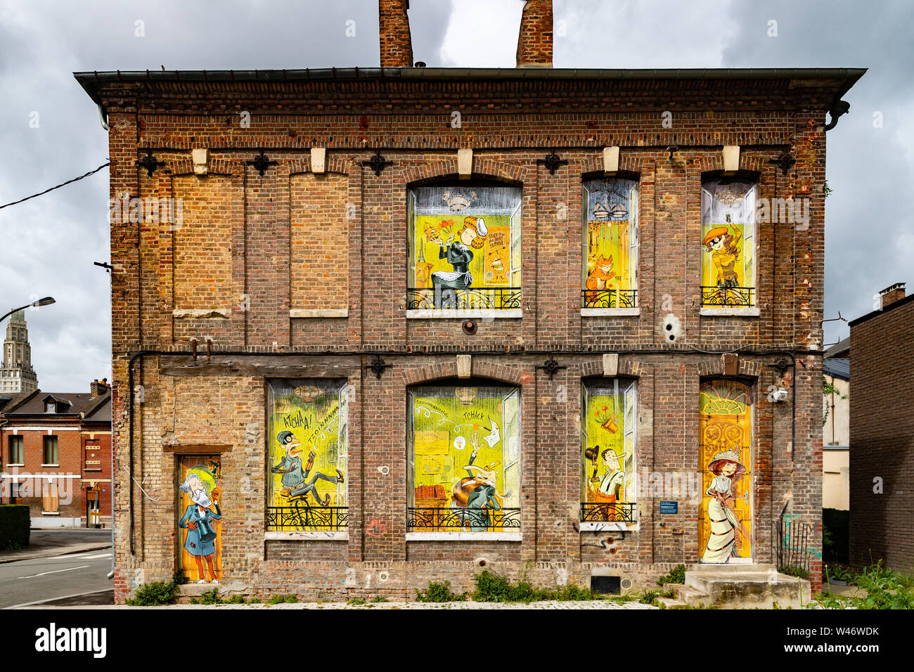 Red brick building with paintings in Amiens, France Stock Photo - Alamy