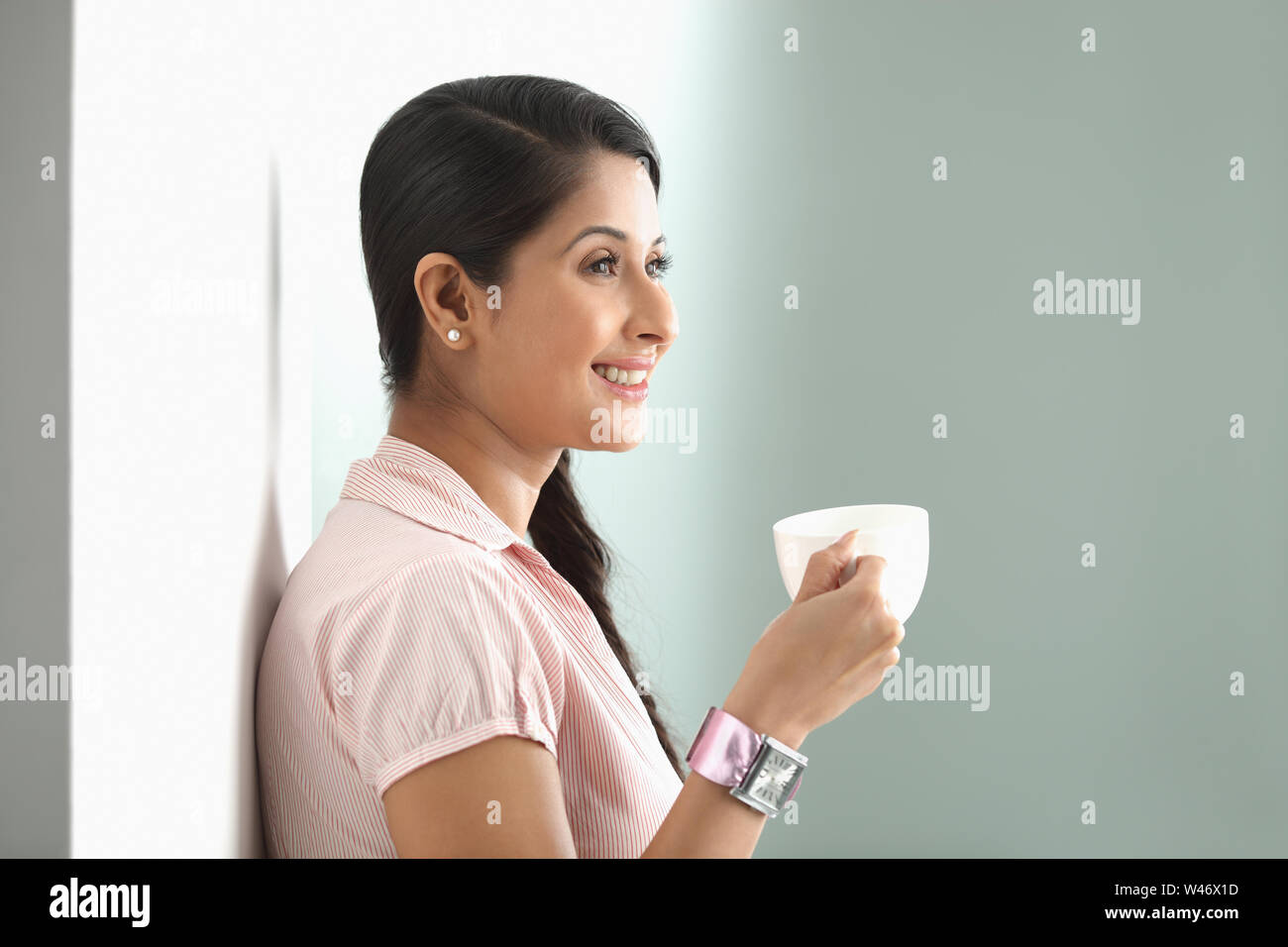 Indian young woman having a cup of tea Stock Photo - Alamy