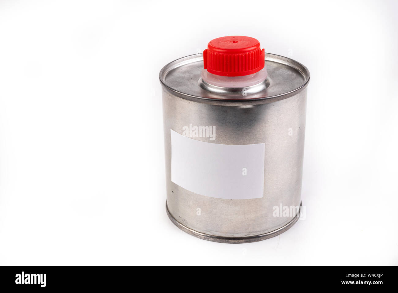 Metal container for chemicals with a white blank sticker. A tin plate ...