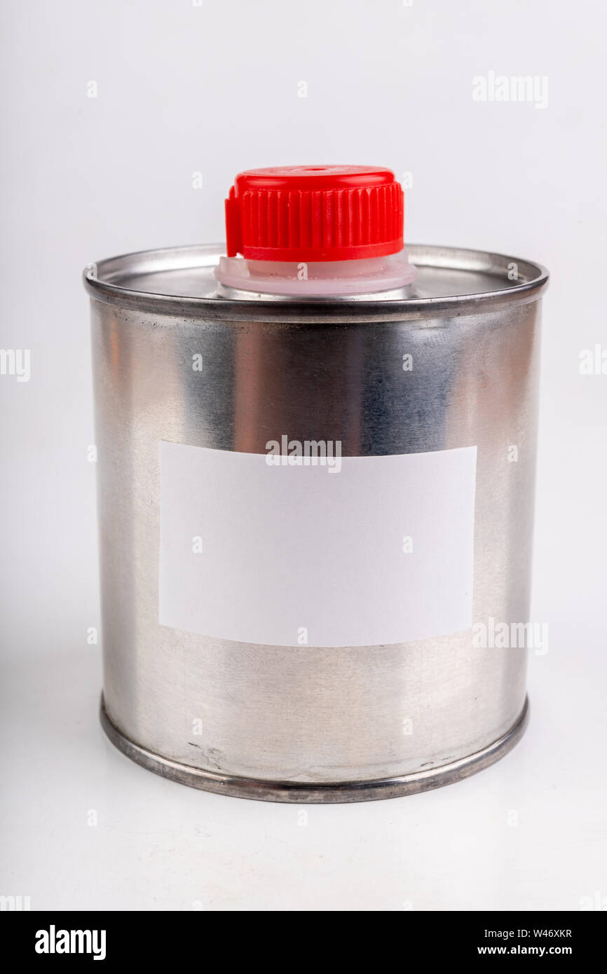 Metal container for chemicals with a white blank sticker. A tin plate ...
