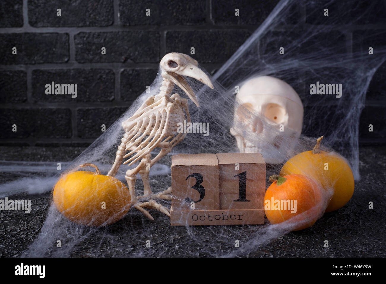 Halloween background with wooden calendar and bird skeleton Stock Photo ...