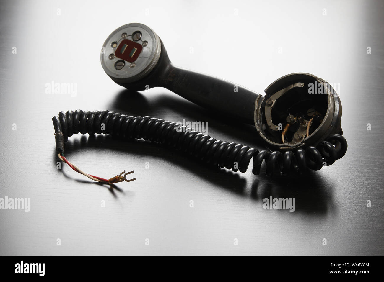 Broken Vintage Telephone Handset on Wooden Background Stock Photo - Alamy