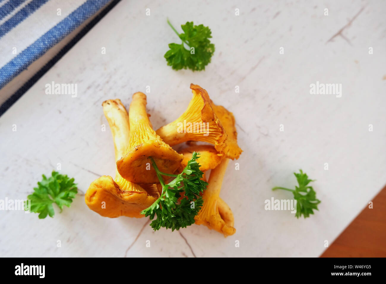 fresh golden chanterelles on light grey background flat lay Stock Photo ...